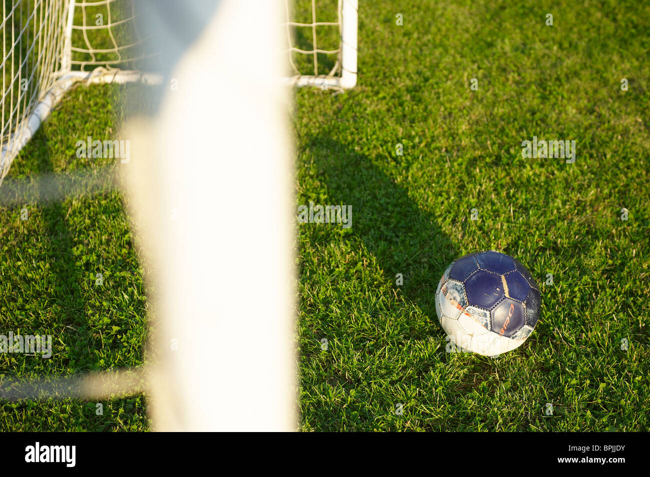 Soccer Ball on Grass in Front of Goal Stock Photo - Alamy
