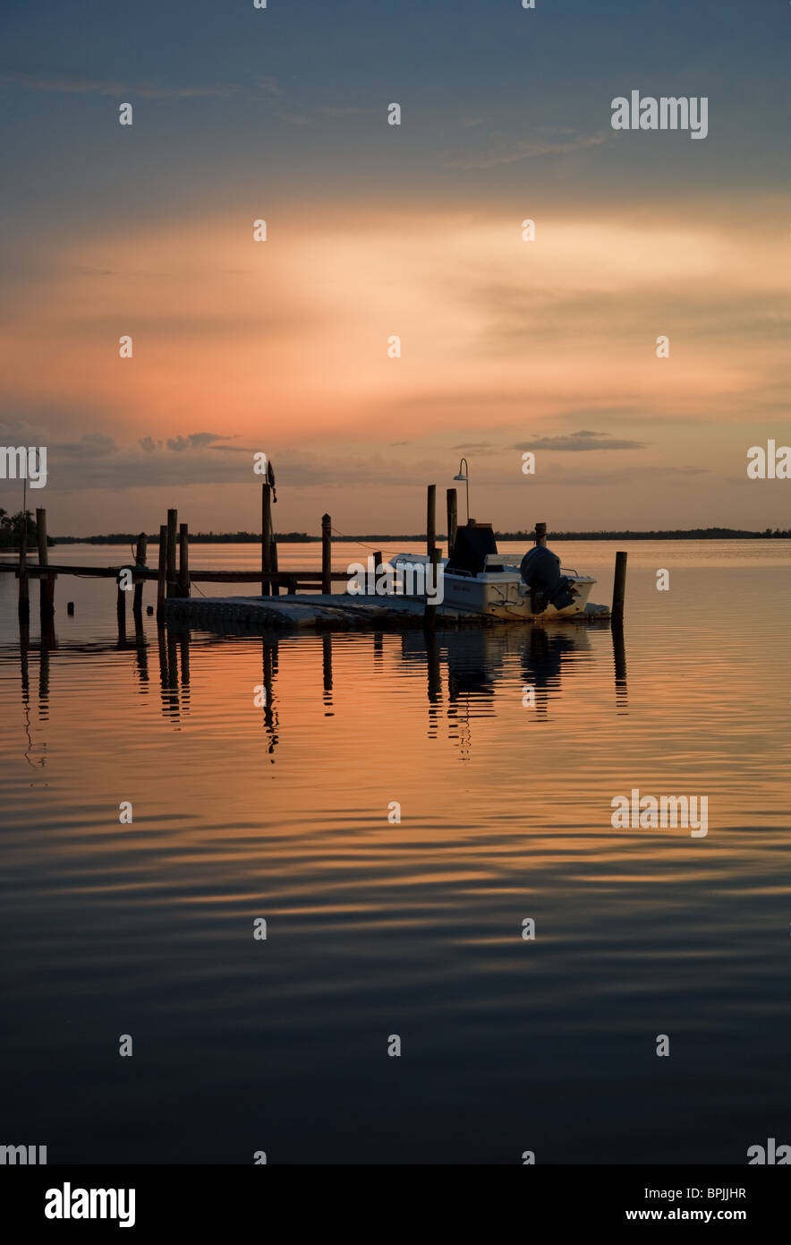 Serene sunset at boat dock Stock Photo - Alamy
