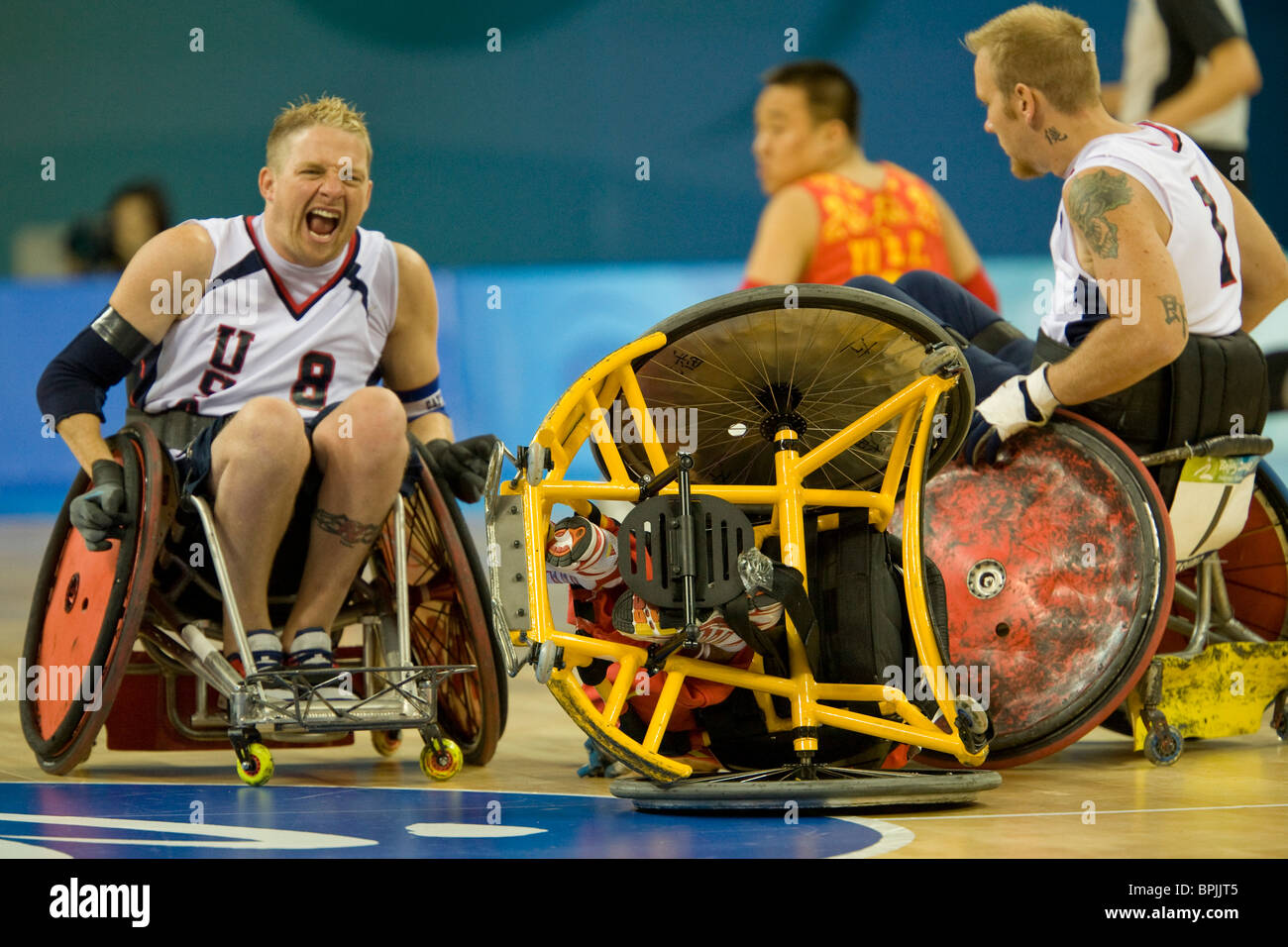 Chinese rugby player toppled between USA players Scott Hogsett (l) and ...