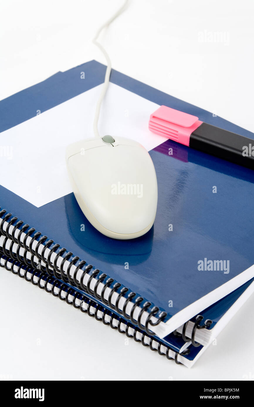 Blue school textbook and computer mouse, online learning Stock Photo ...
