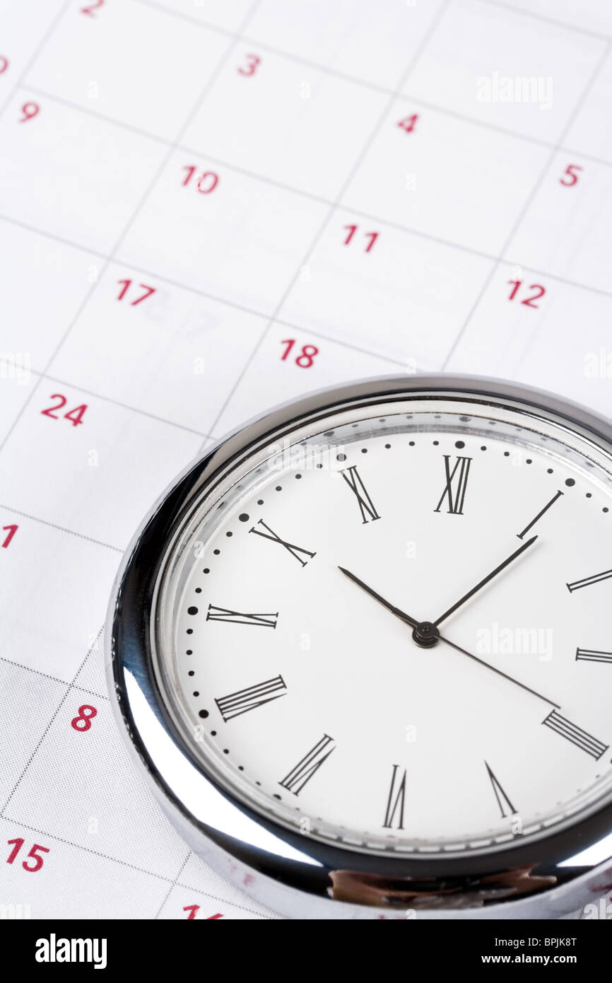 calendar and clock close up shot Stock Photo - Alamy