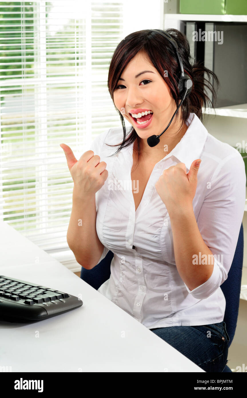 Enthusiastic Call Center Telephone Sales Person With Thumbs Up Sign ...