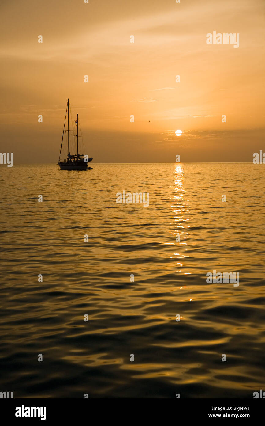 Serene sunset scene boat glowing hi-res stock photography and images ...