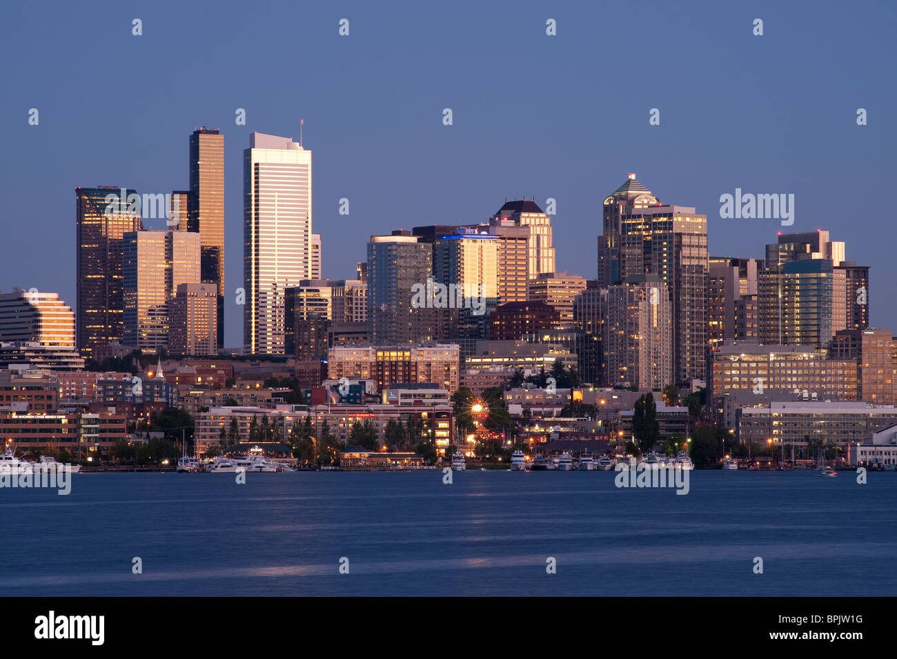 Retro image of Seattle skyline, Lake Union at twilight with city lights ...