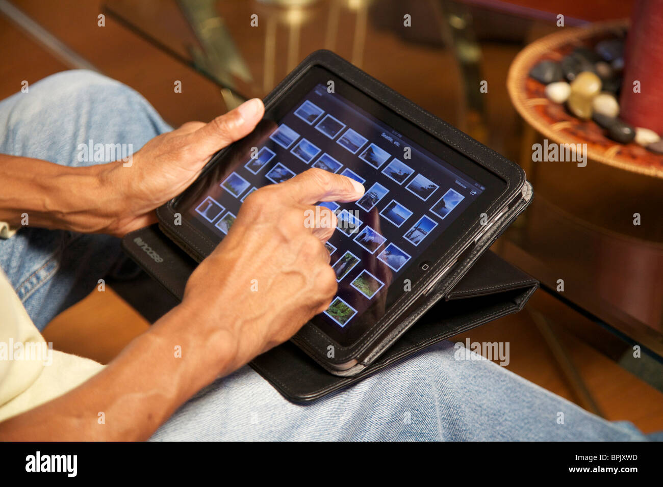 African-American man using Apple iPad. Closeup of hands Stock Photo - Alamy