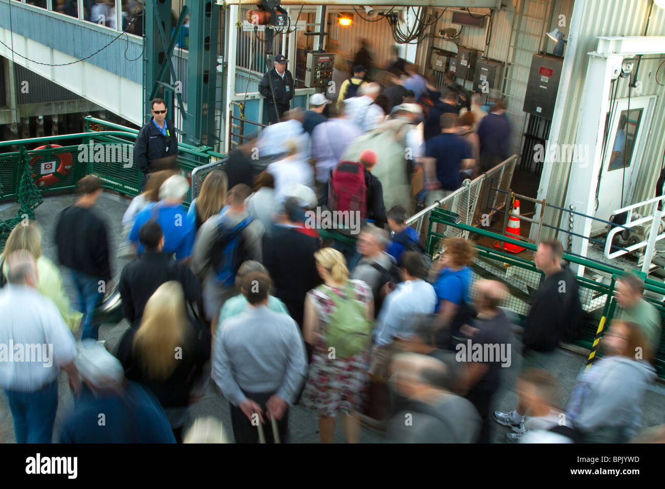 Passengers, commuters, disembark the Seattle ferry as they commute to ...
