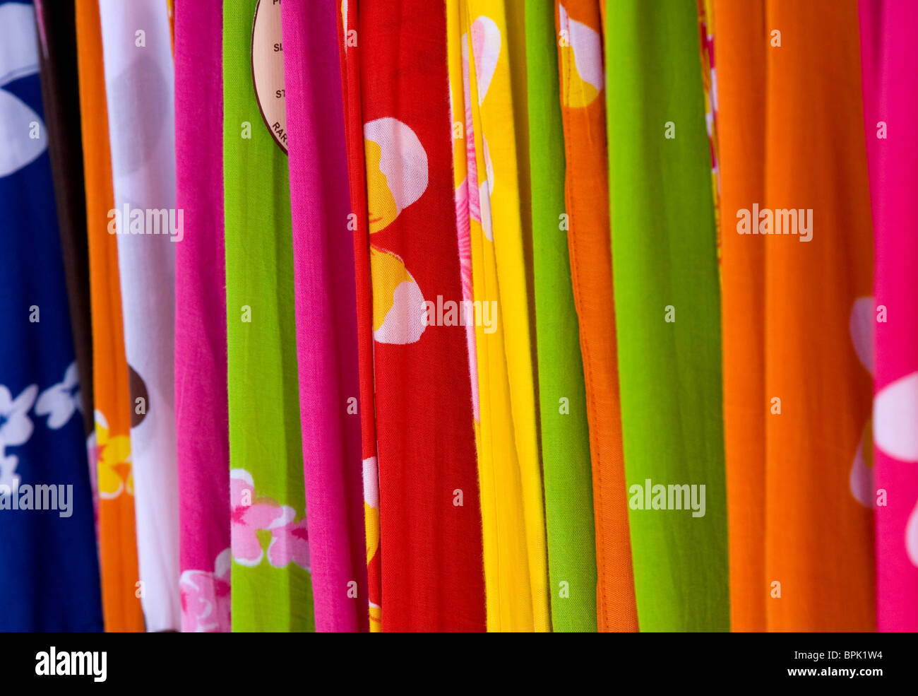 French Polynesia, Cook Islands, Rarotonga. Colorful tropical fabrics on ...