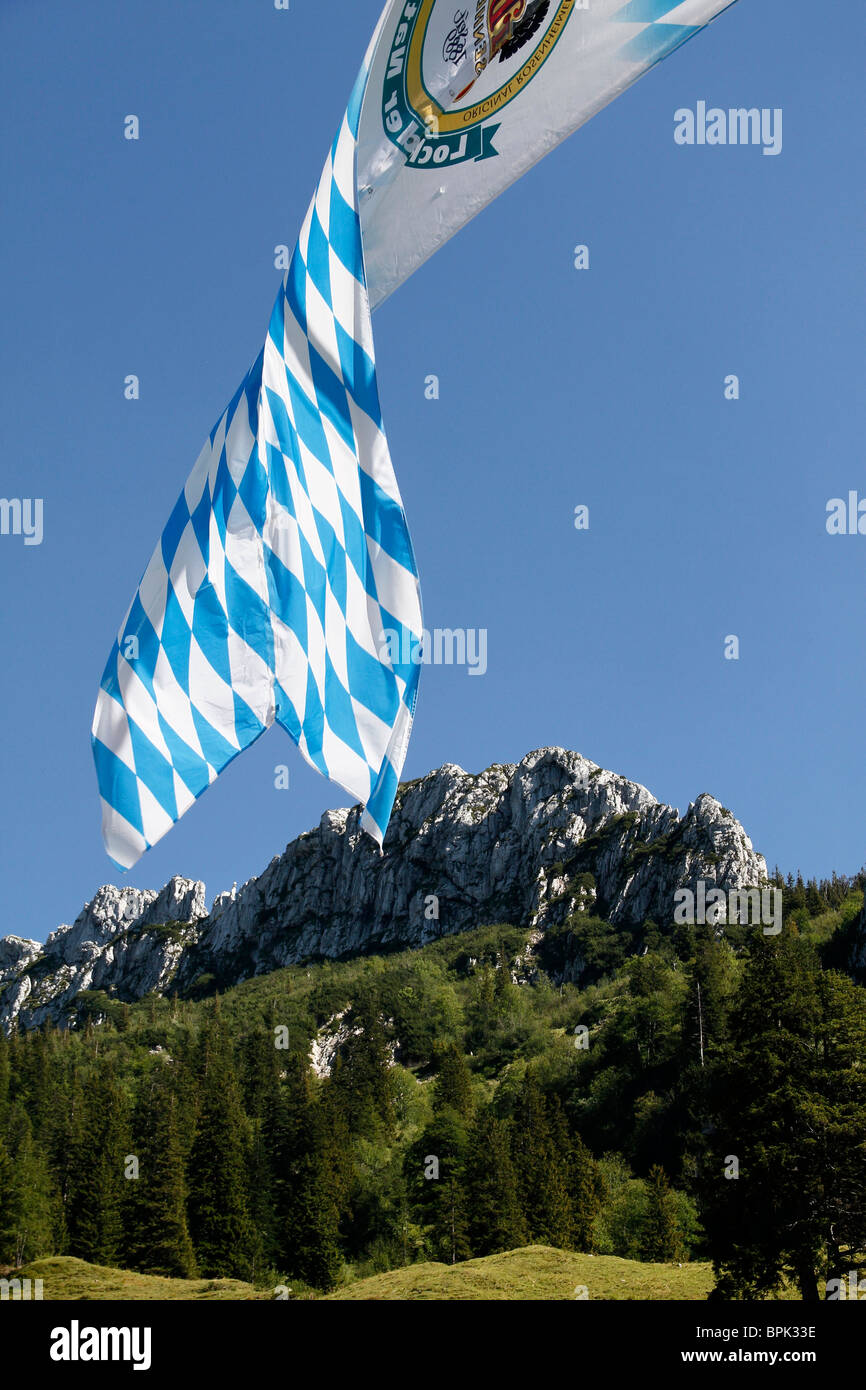 Flag with Bavarian Colours and the Kampenwand, Chiemgau Upper Bavaria ...