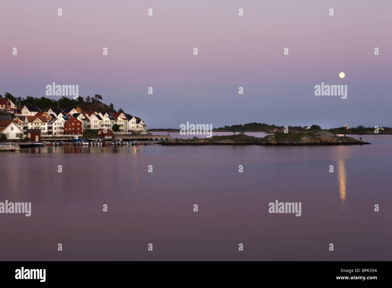 Houses at skerry coastline at sunset, Skagerrak, Sorland, Norway ...