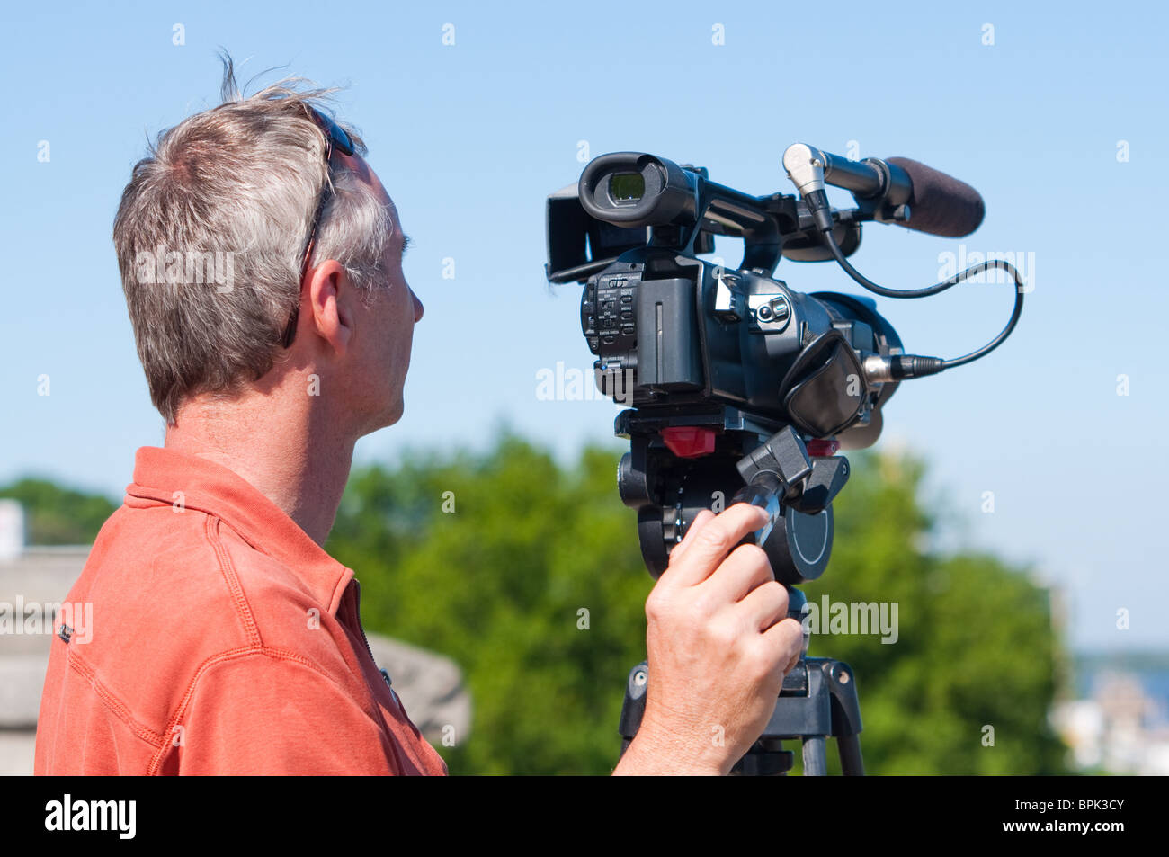 man with the video camera Stock Photo - Alamy