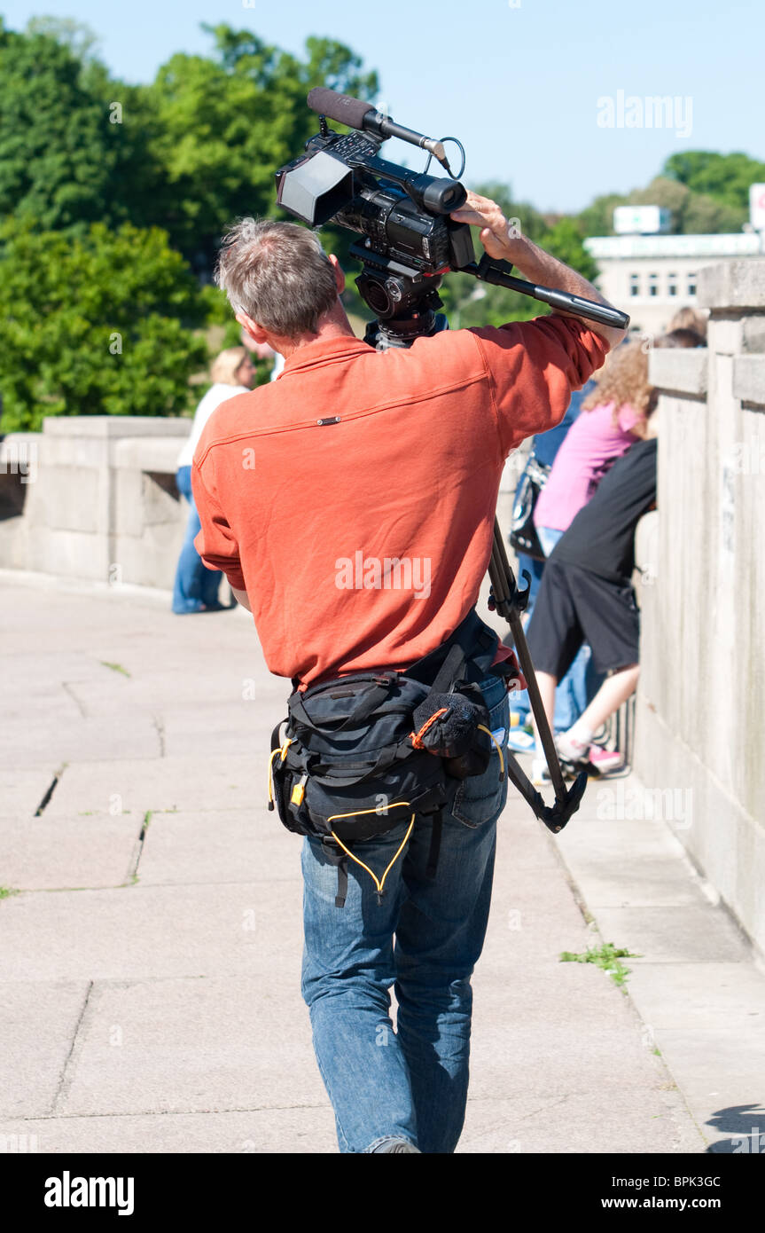 man with the video camera Stock Photo - Alamy