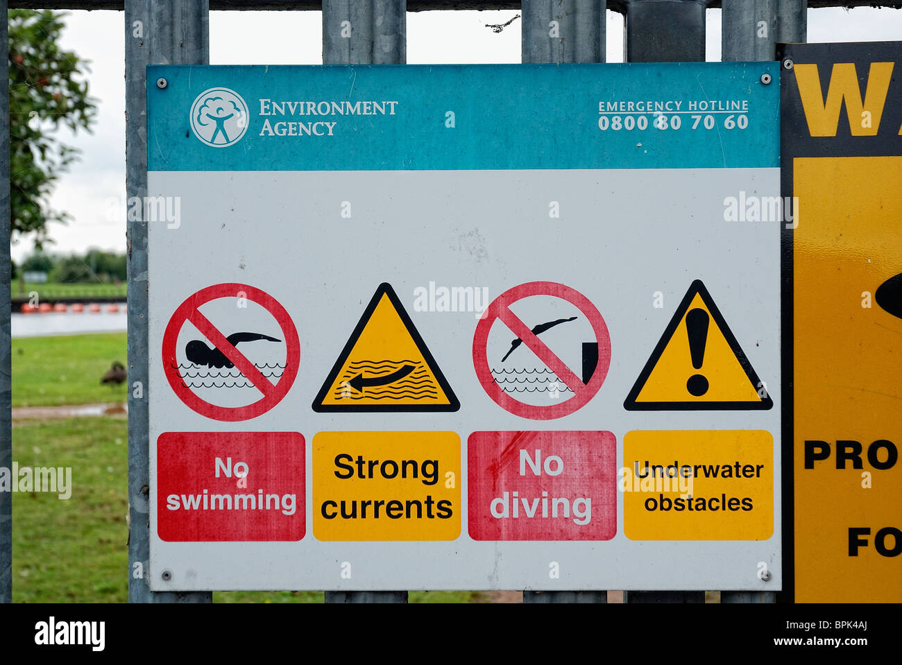 warning sign on gate Stock Photo - Alamy