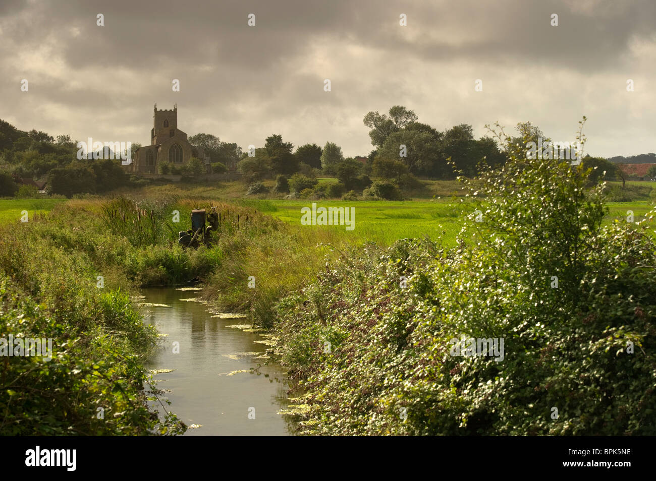 Wiveton Parish Church viewed from Cley over the fields Stock Photo - Alamy