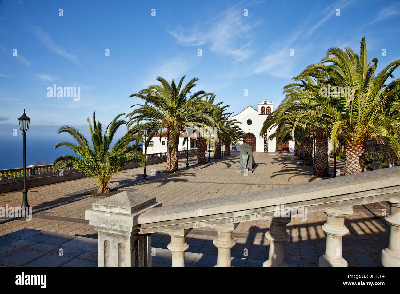 Church behind palm trees in the sunlight, Santo Domingo de Garafia, La ...