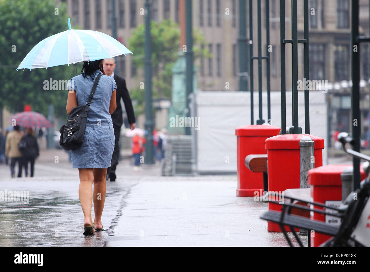Young Women walking with Umbrella Stock Photo - Alamy
