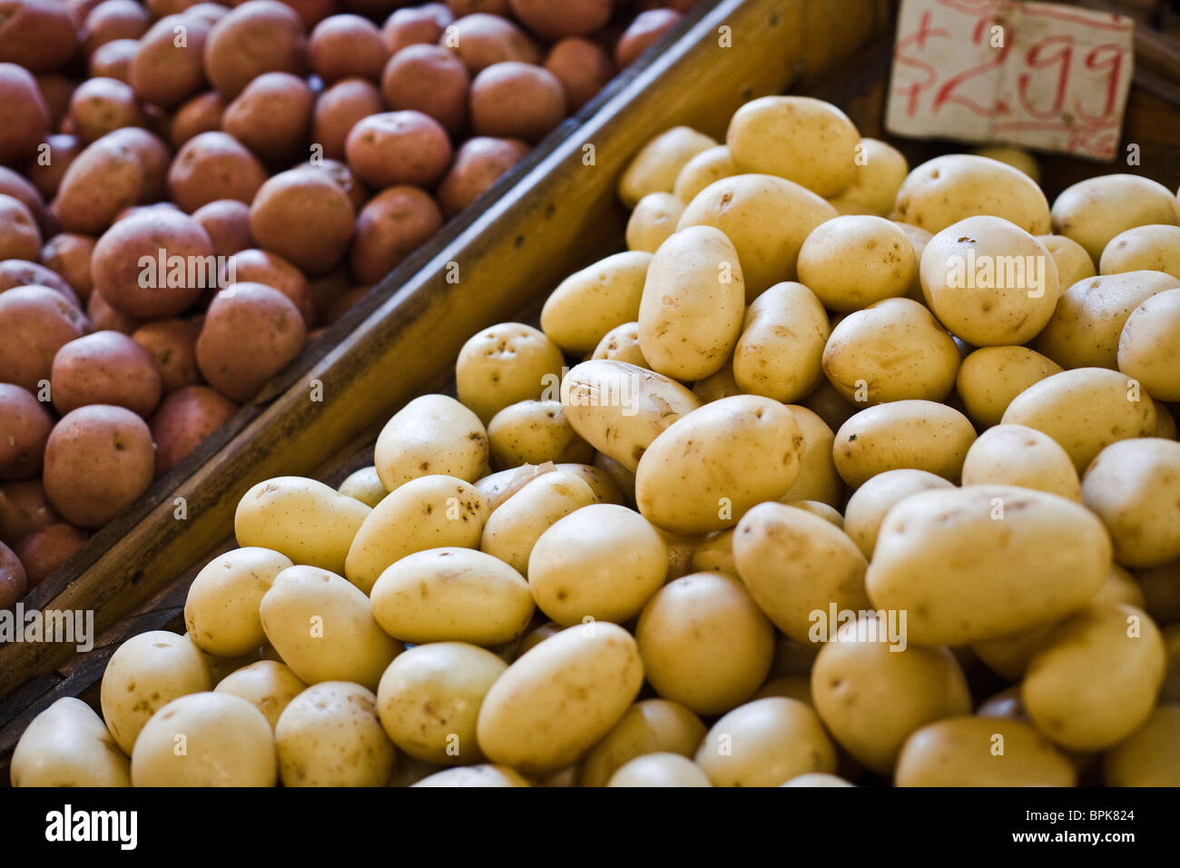 Shiny fresh produce stacked high in a market Stock Photo - Alamy