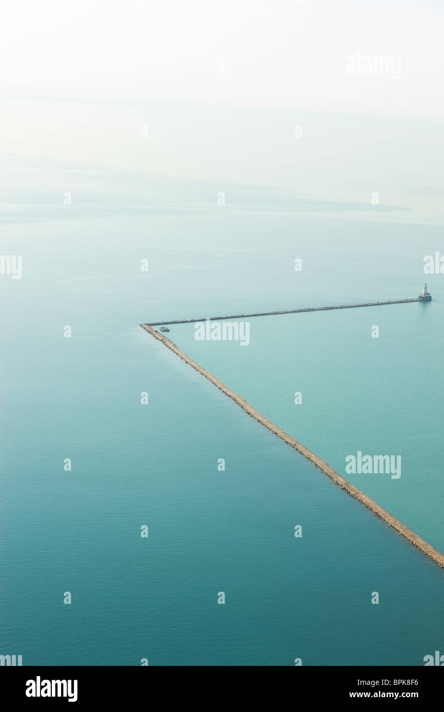 Abstract aerial photograph of breakwater jetty in water in Lake ...