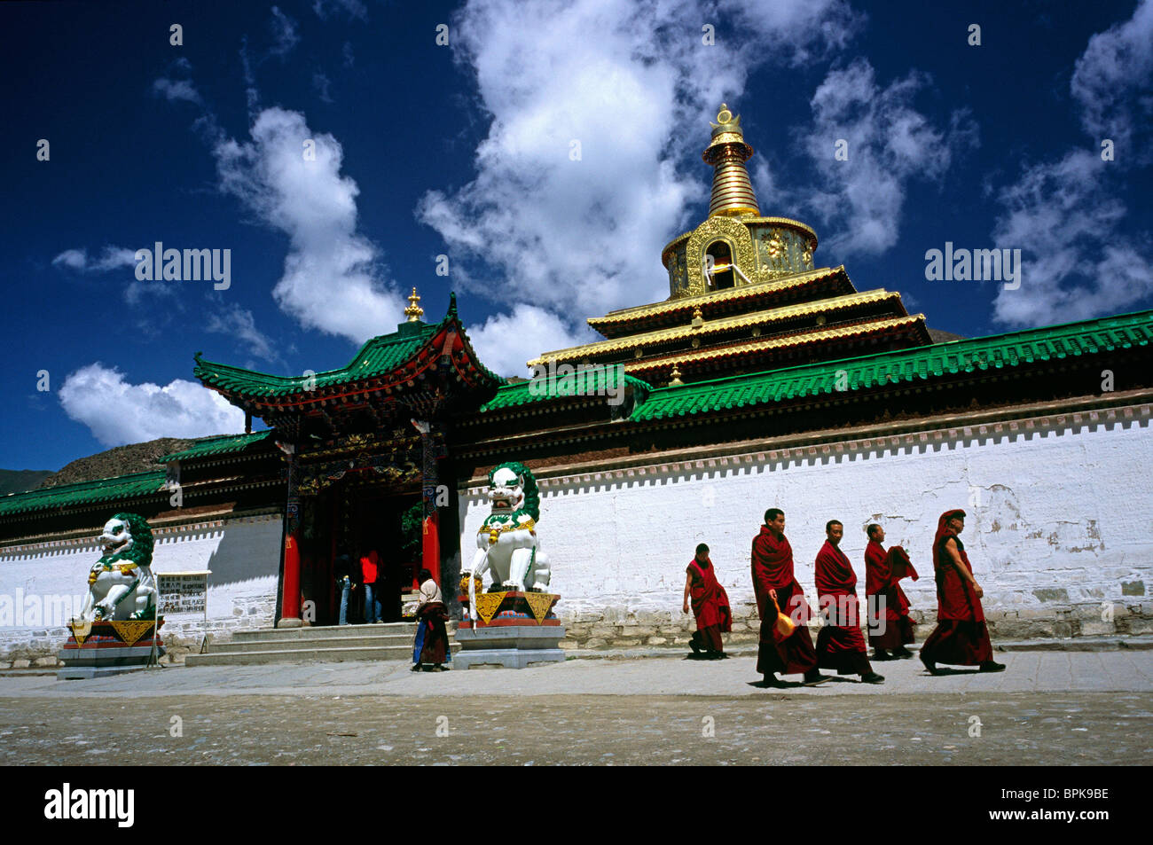 Local monks passing Gong Tang pagoda at Labrang Lamma Buddhist ...