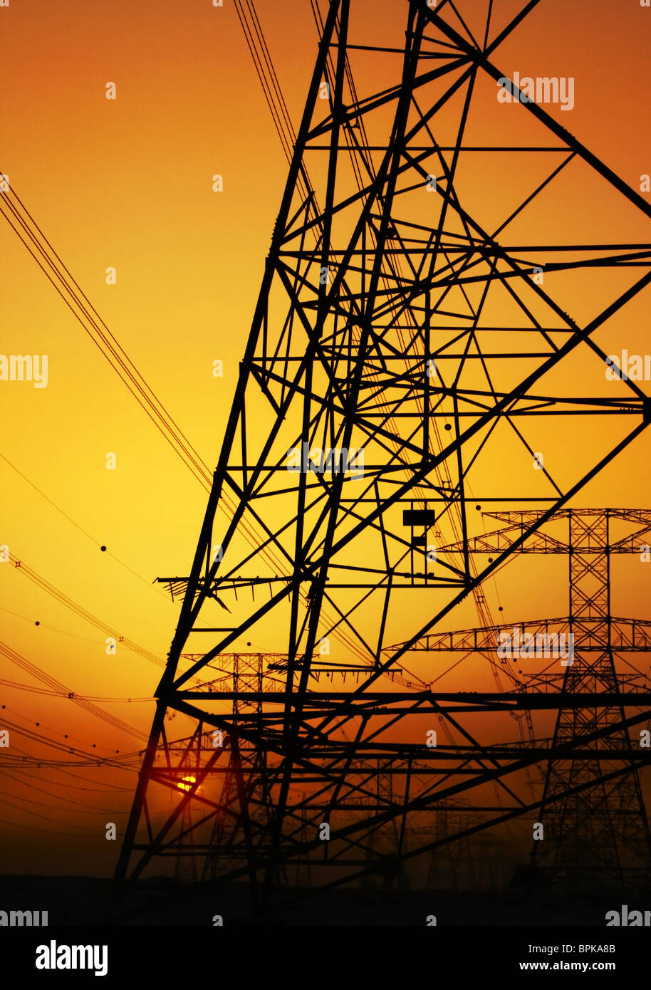 Electricity Pylon over orange sunset sky. Environmental damage Stock ...