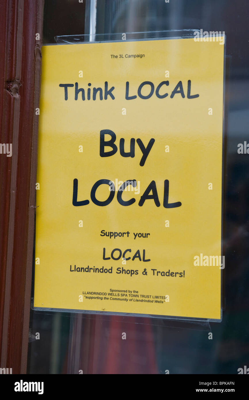 THINK LOCAL BUY LOCAL sign in shop window at Llandrindod Wells Powys ...