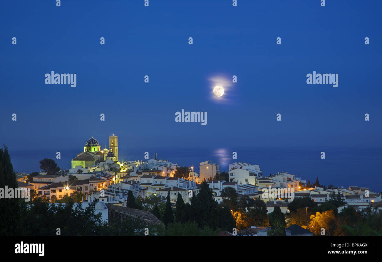 Altea old town at dusk, with its illuminated church domes and houses ...