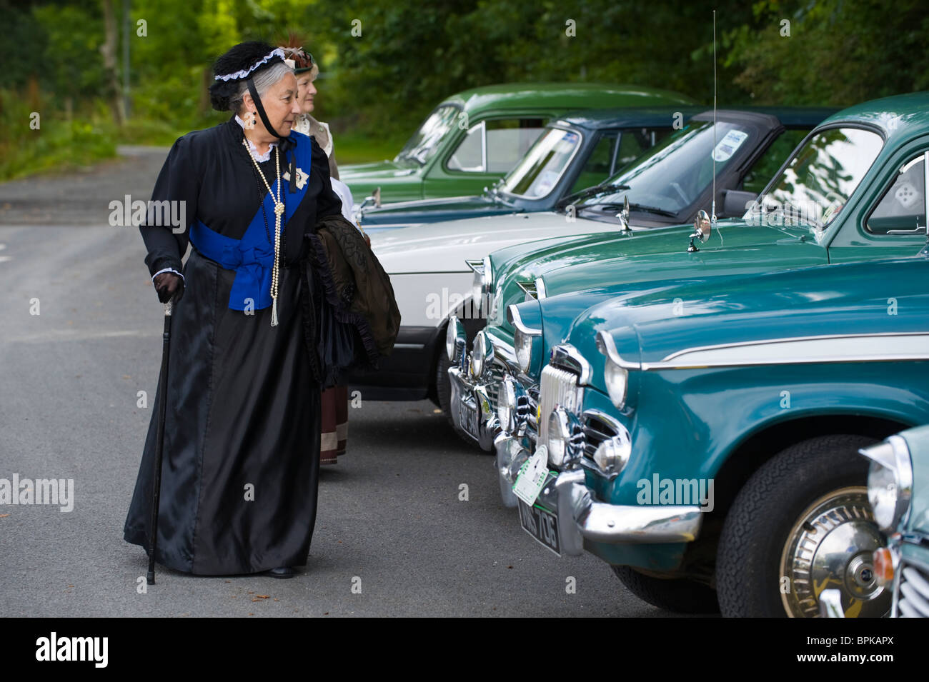Queen Victoria looking at restored classic motor cars on show during ...