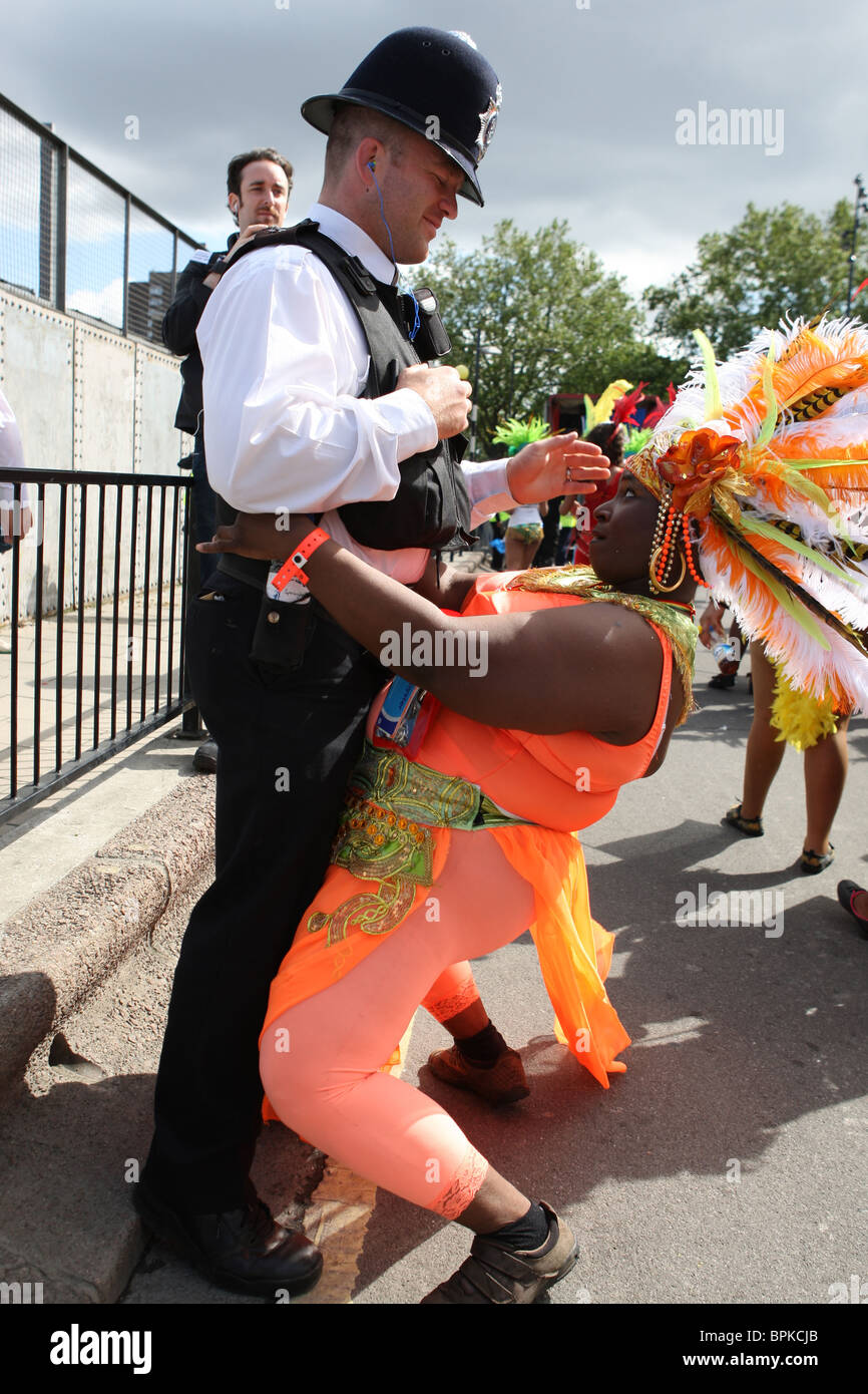 Performer is dancing in front of a policeman during the Parade at ...