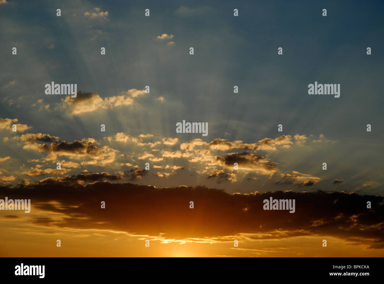 Sunburst through clouds hi-res stock photography and images - Alamy