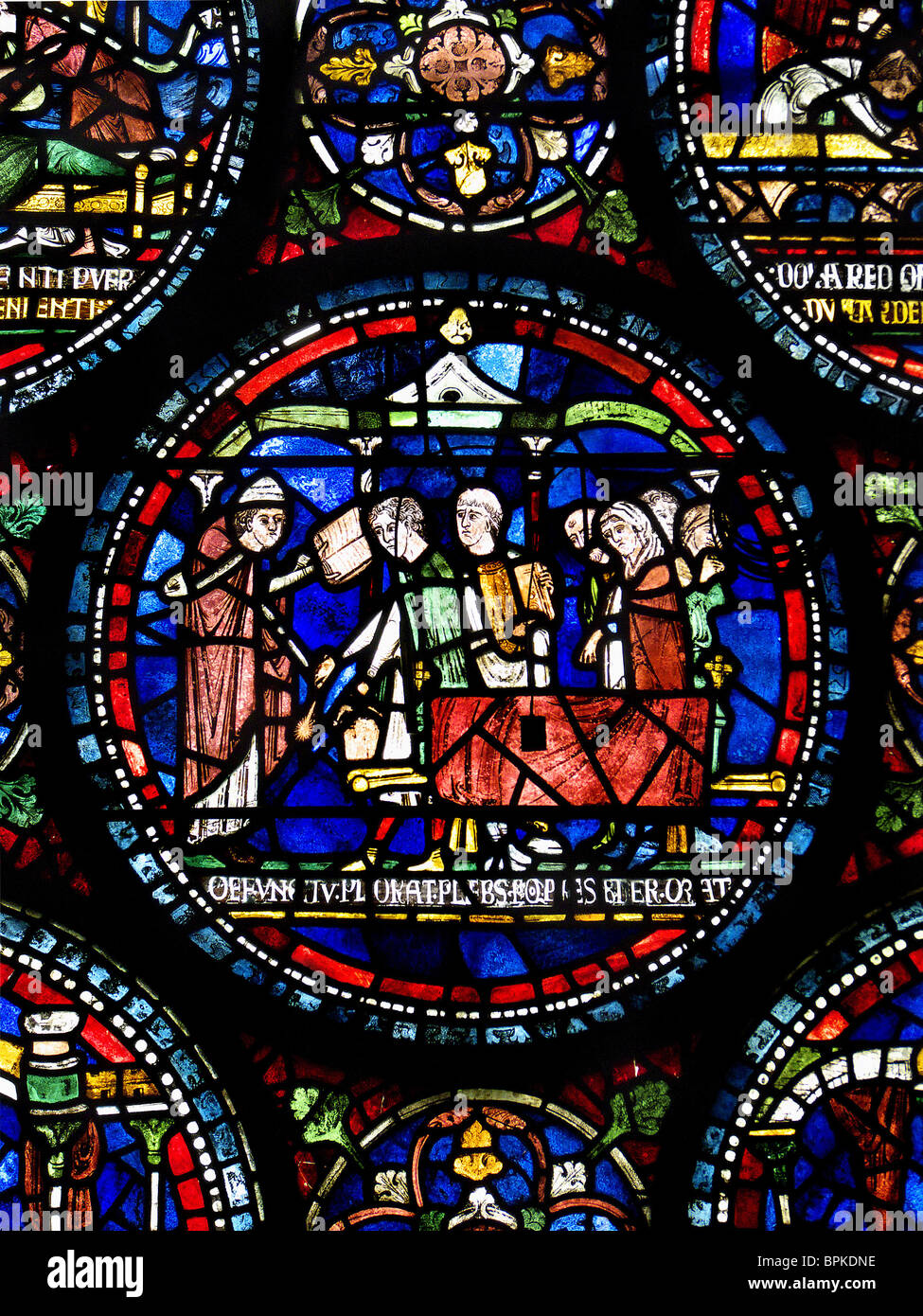 Miracle stained glass window showing a bishop or archbishop officiating ...