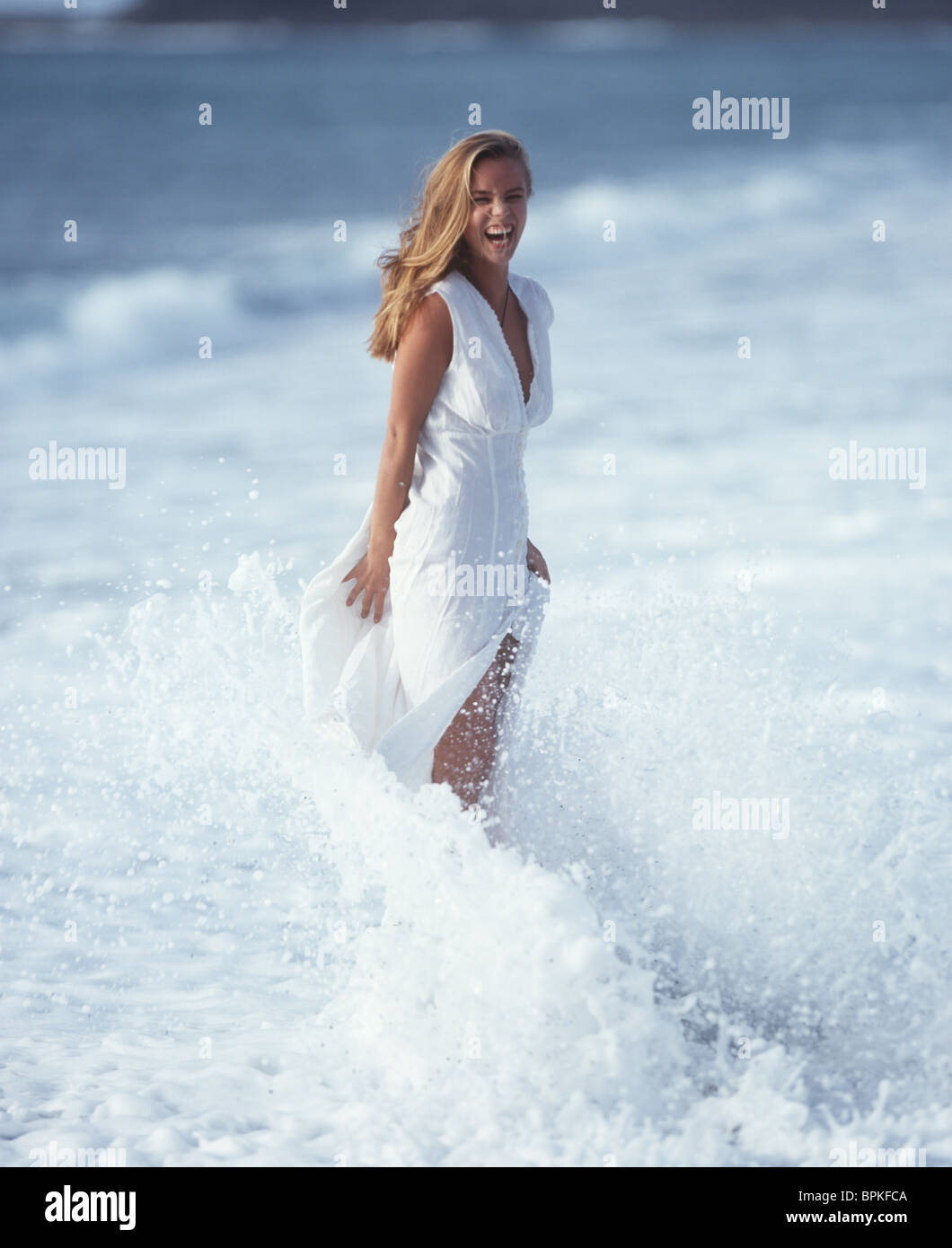 Young woman smiling in the sea Stock Photo - Alamy