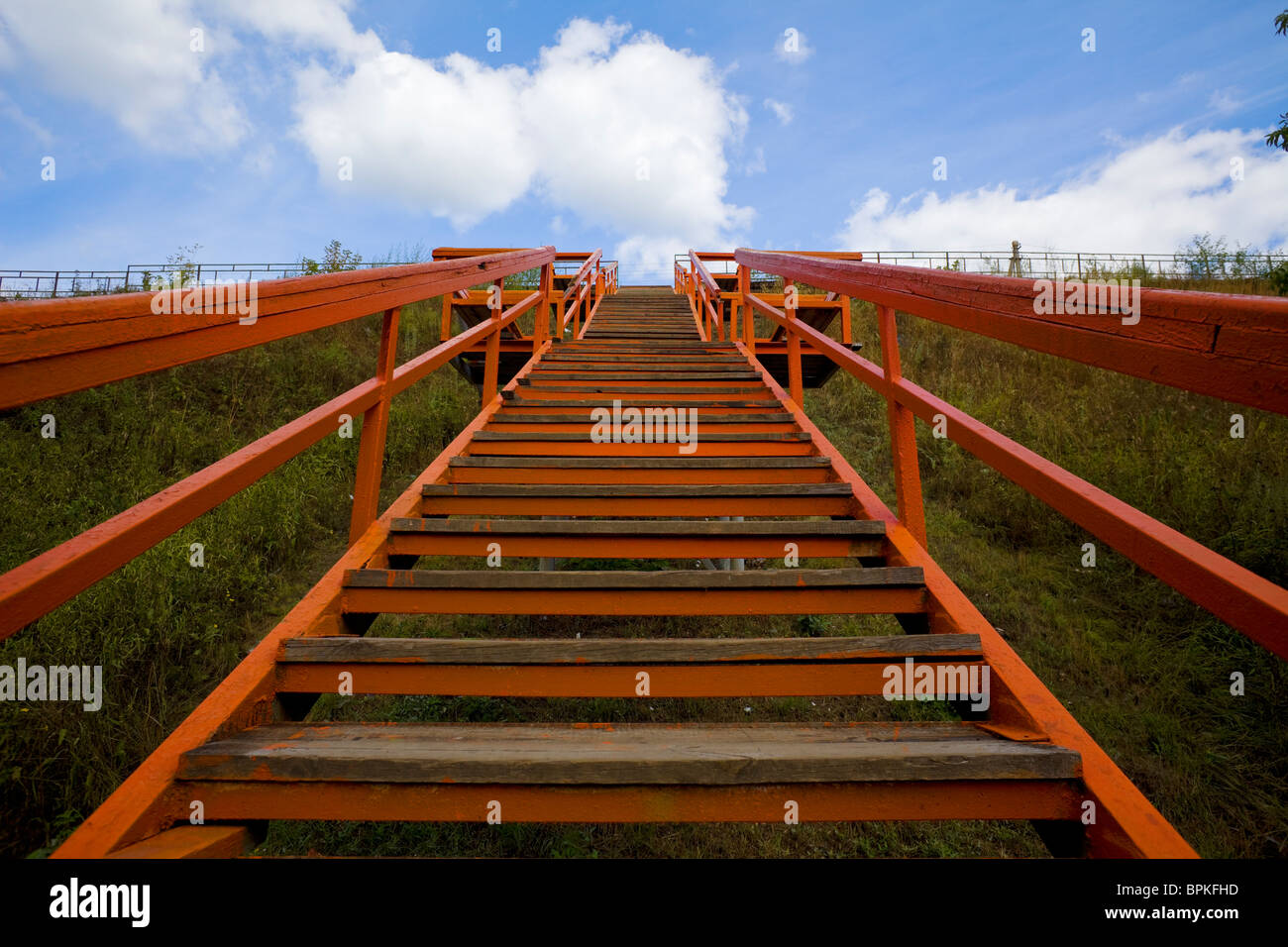 Red metal stair in the sky Stock Photo - Alamy