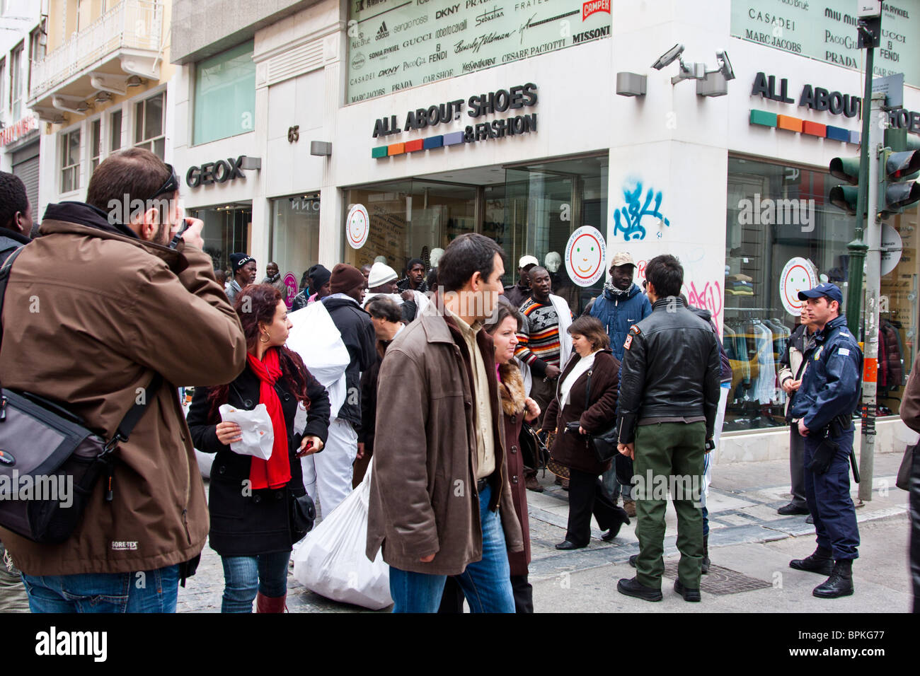 ATHENS, GREECE - FEBRUARY 14: Immigrants selling counterfeit goods ...