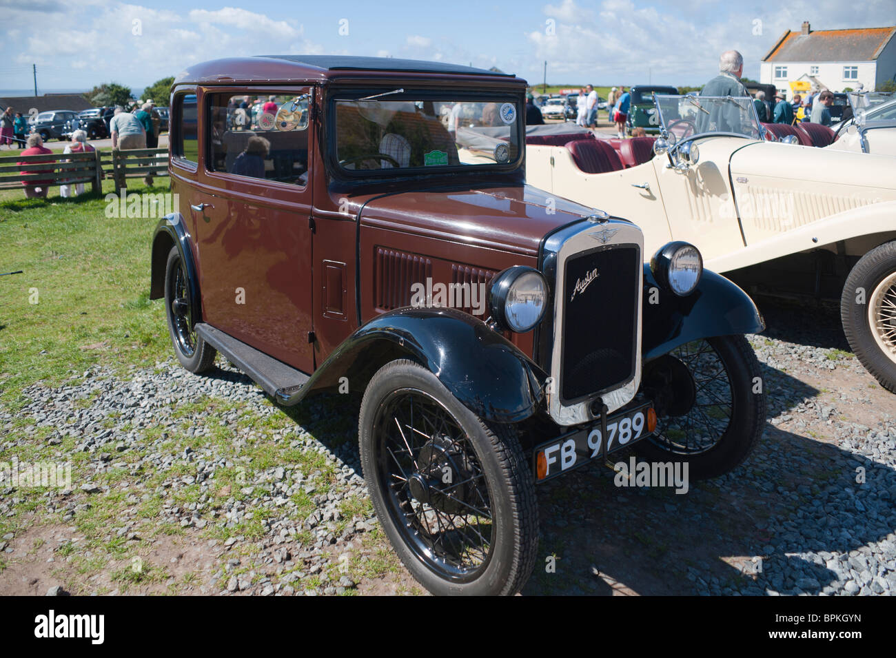 People enjoying a classic car show at the Lizard in Cornwall. Bank ...