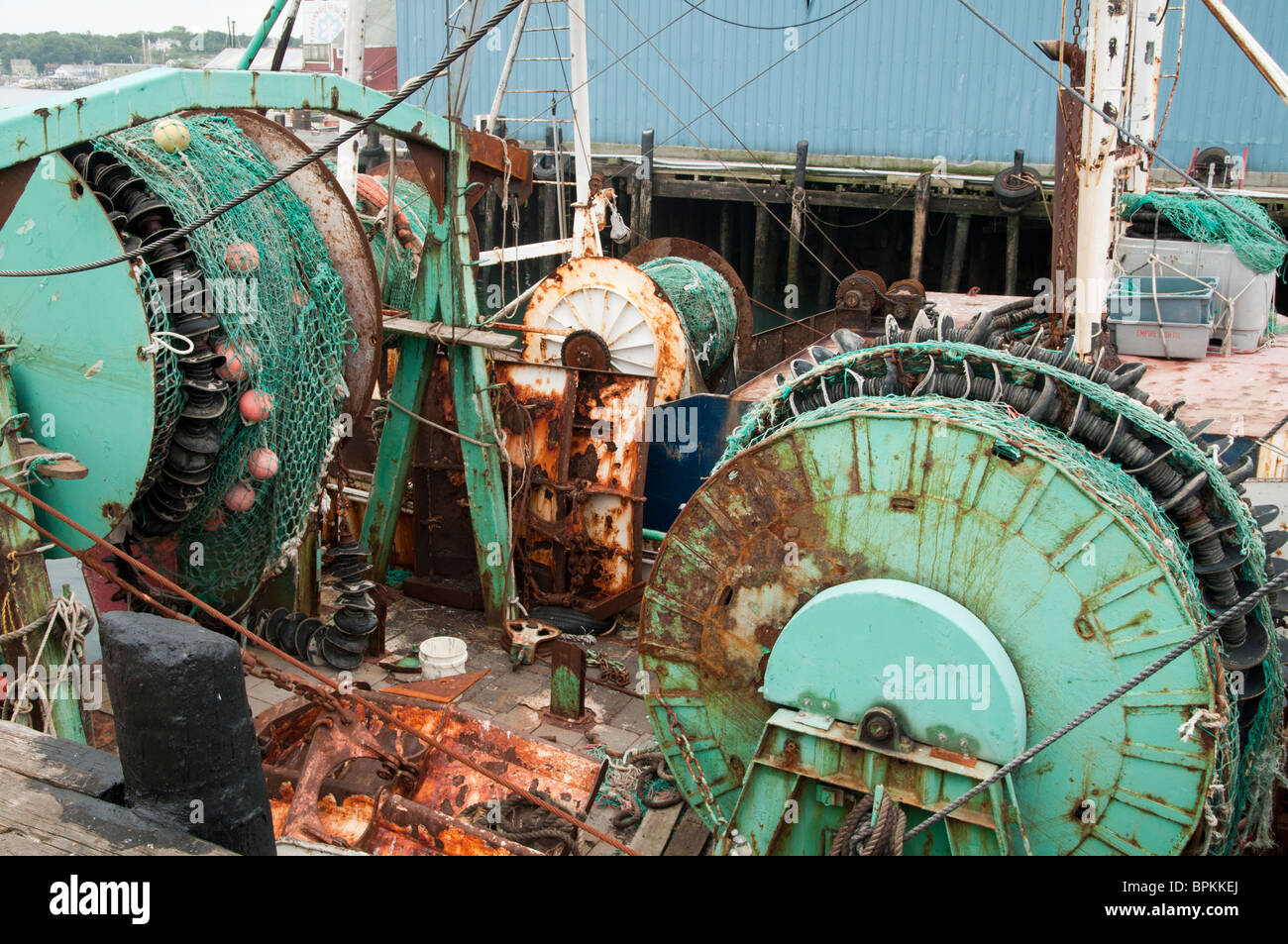 The deck on an old fishing trawler in Gloucester, MA is a cacophony of ...