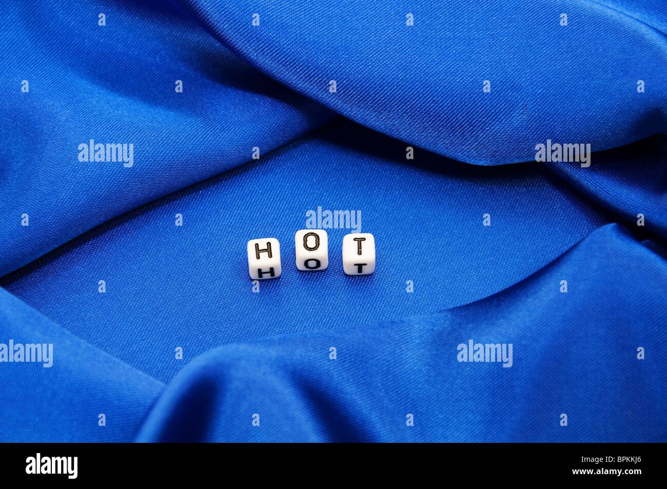 Satin saying shiny silky smooth word wording wrinkled wrinkles buttons ...