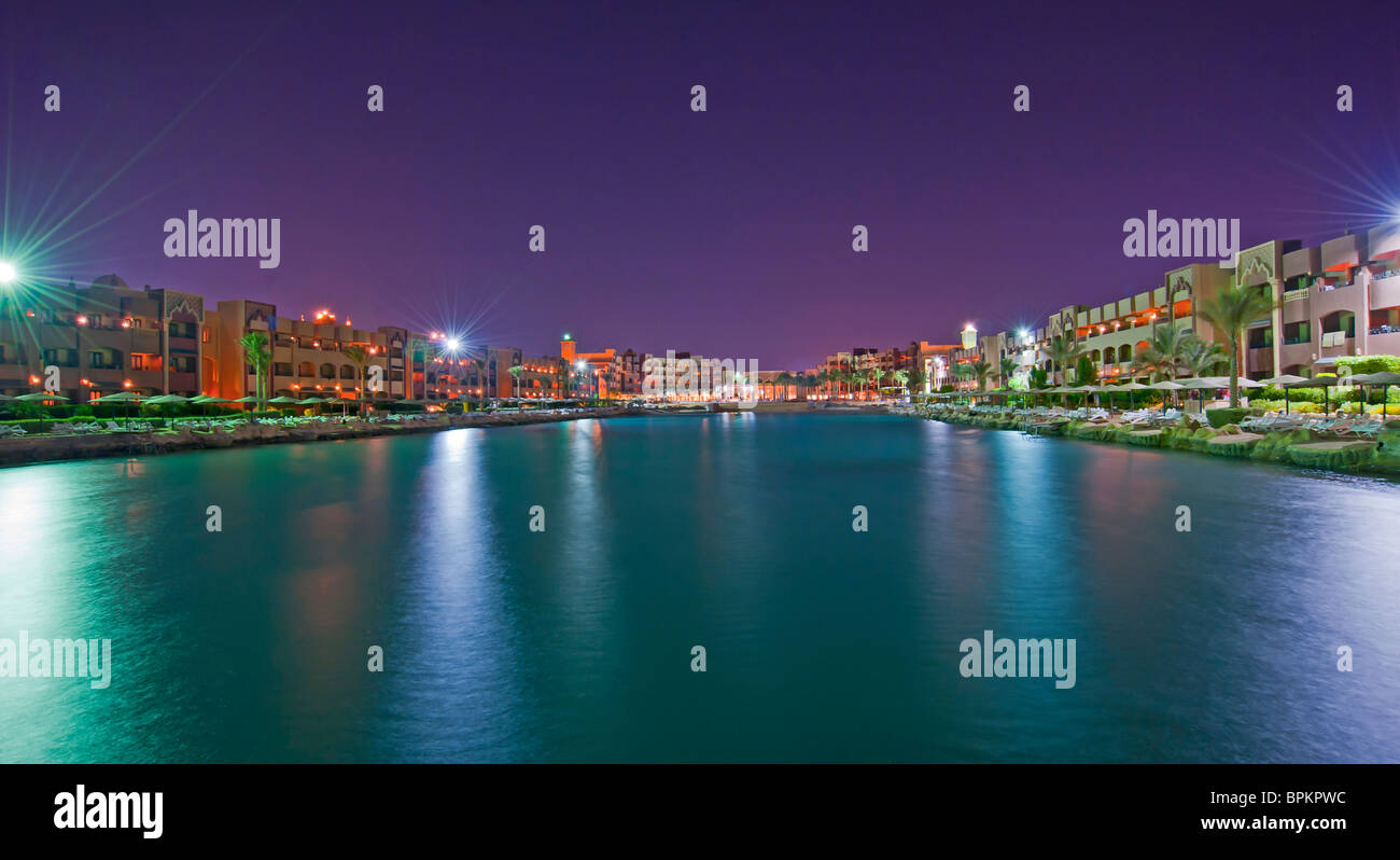 Lagoon in a tropical luxury hotel lit up at night Stock Photo - Alamy