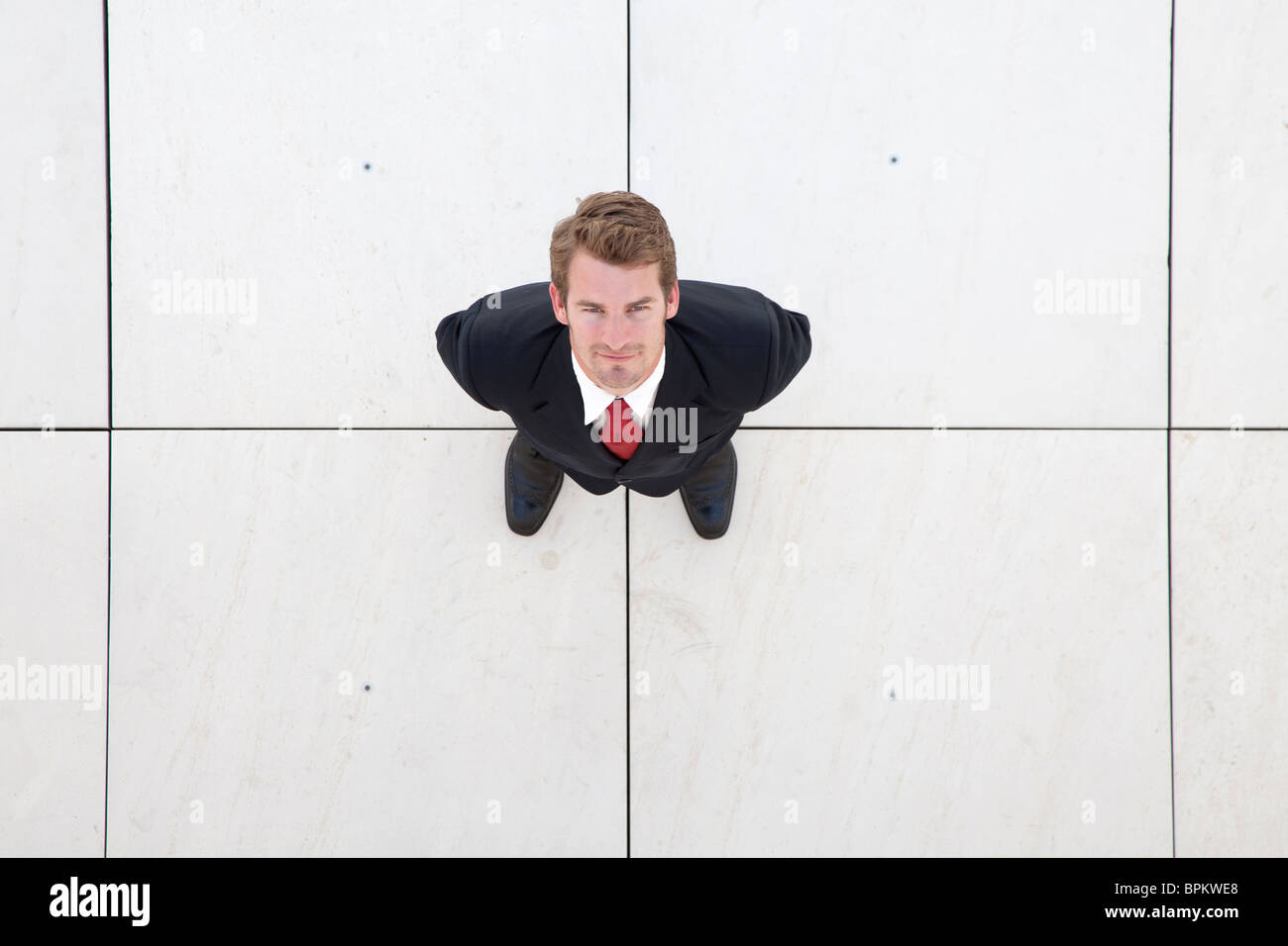 Businessman looking up Stock Photo - Alamy