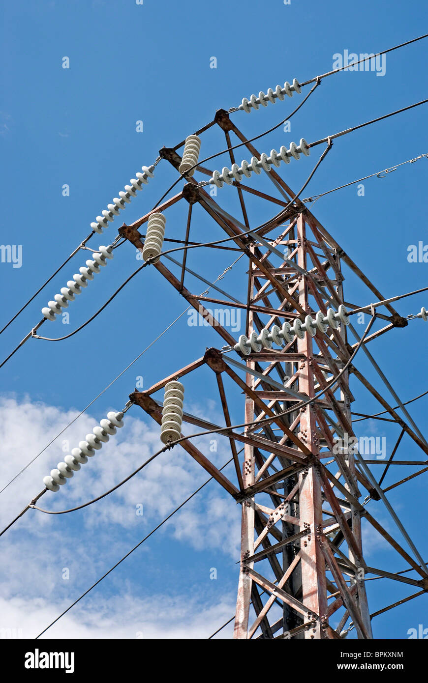 Outdoor power lines - tower structure, insulators close-up against ...