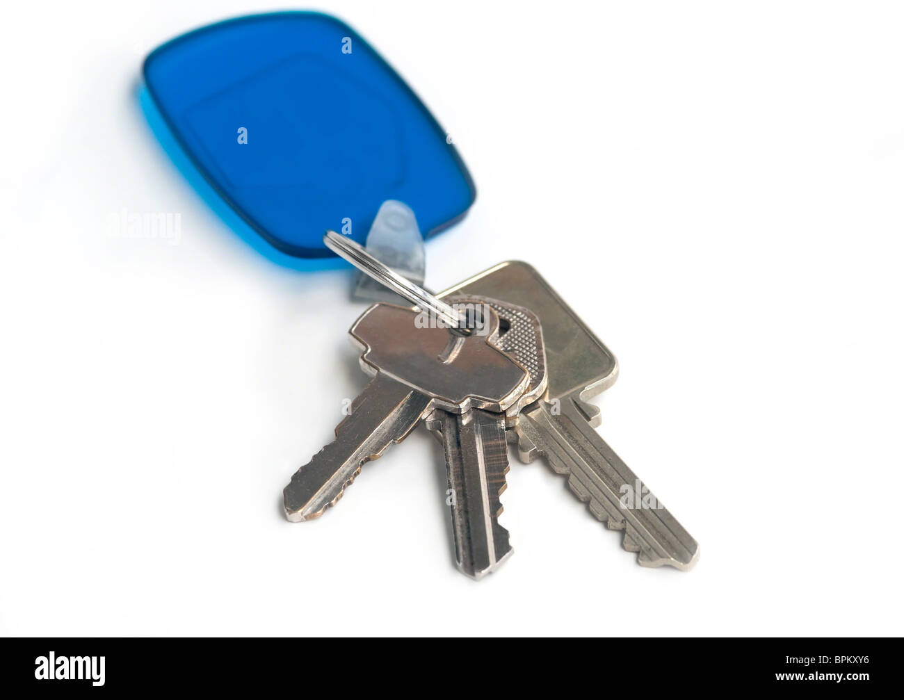 Home keys - set of three with a transparent blue holder. Isolated on ...