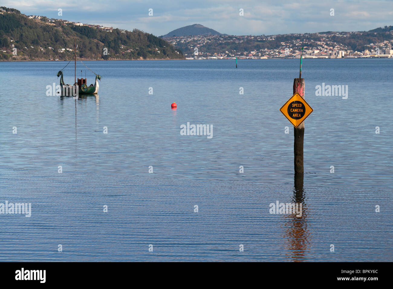 Speed camera sign in Dunedin Harbour, New Zealand Stock Photo - Alamy