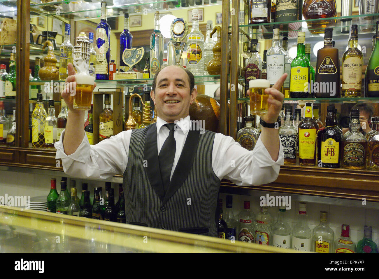 Barkeeper serving ber in a bar, Cava Baja, Madrid, Spain Stock Photo ...