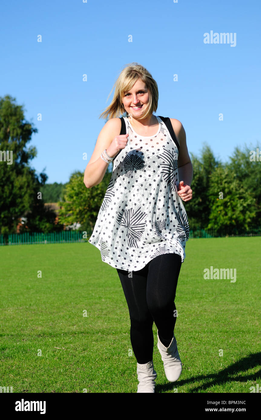 Beautiful female warm out jogging hi-res stock photography and images ...
