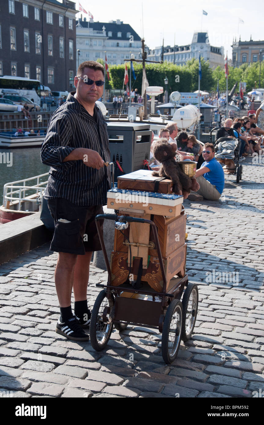 A man with a wind up musical instrument in Copenhagen, Denmark Stock ...