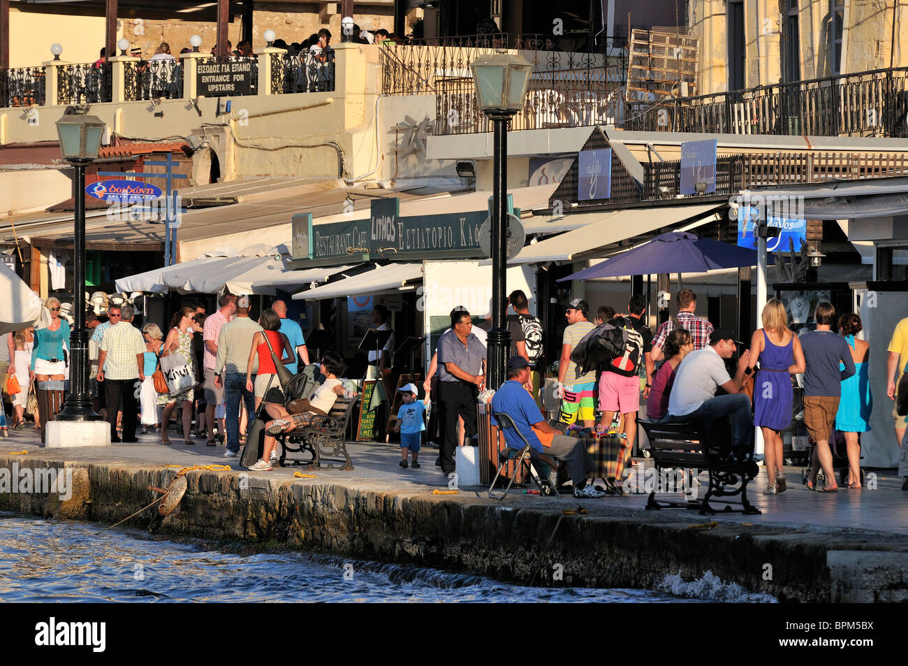 People walking at the old port of Chania, Crete island, Greece Stock ...