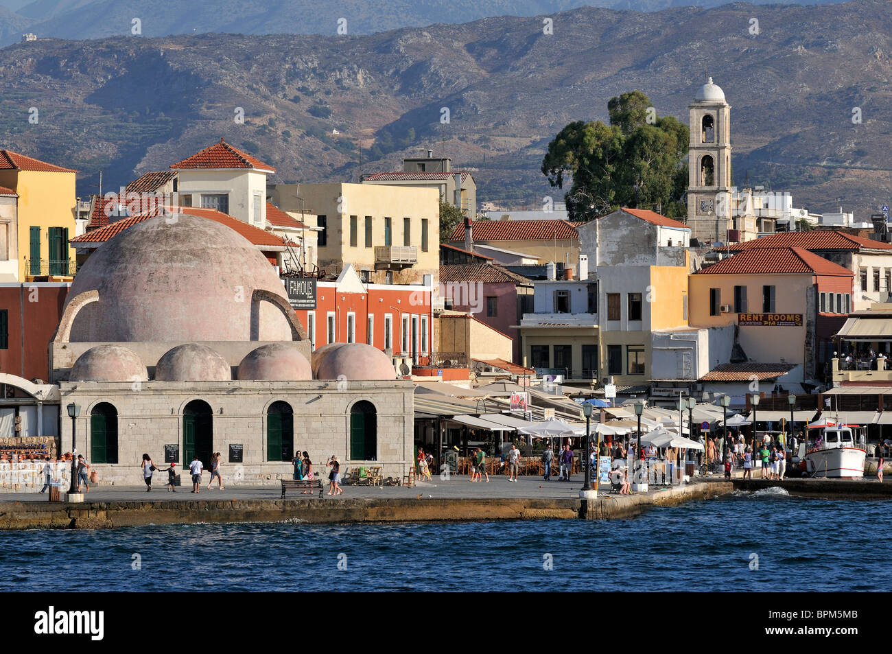 Traditional buildings and Turkish baths at the old port of Chania ...
