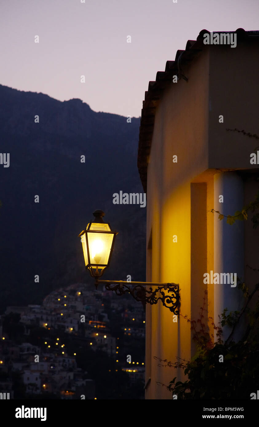 Lantern on a building at dusk Stock Photo - Alamy