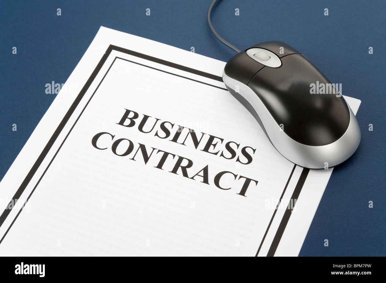Business Contract and computer mouse close up Stock Photo - Alamy