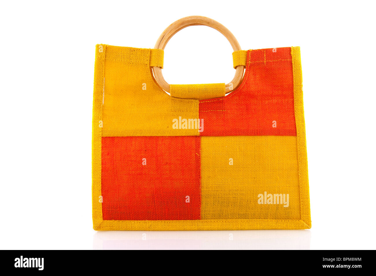 Old retro bag in orange and yellow isolated over white Stock Photo - Alamy