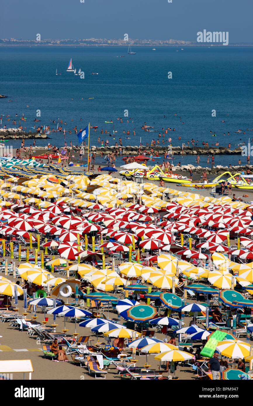 Mass tourism at the beach of Caorle, Adriatic Sea, Italy. Thousands of ...