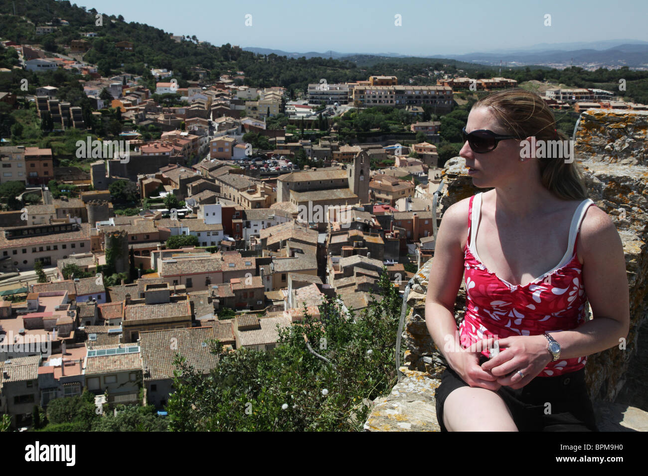 Tourist and aerial view from hill fortress of medieval town Begur near ...